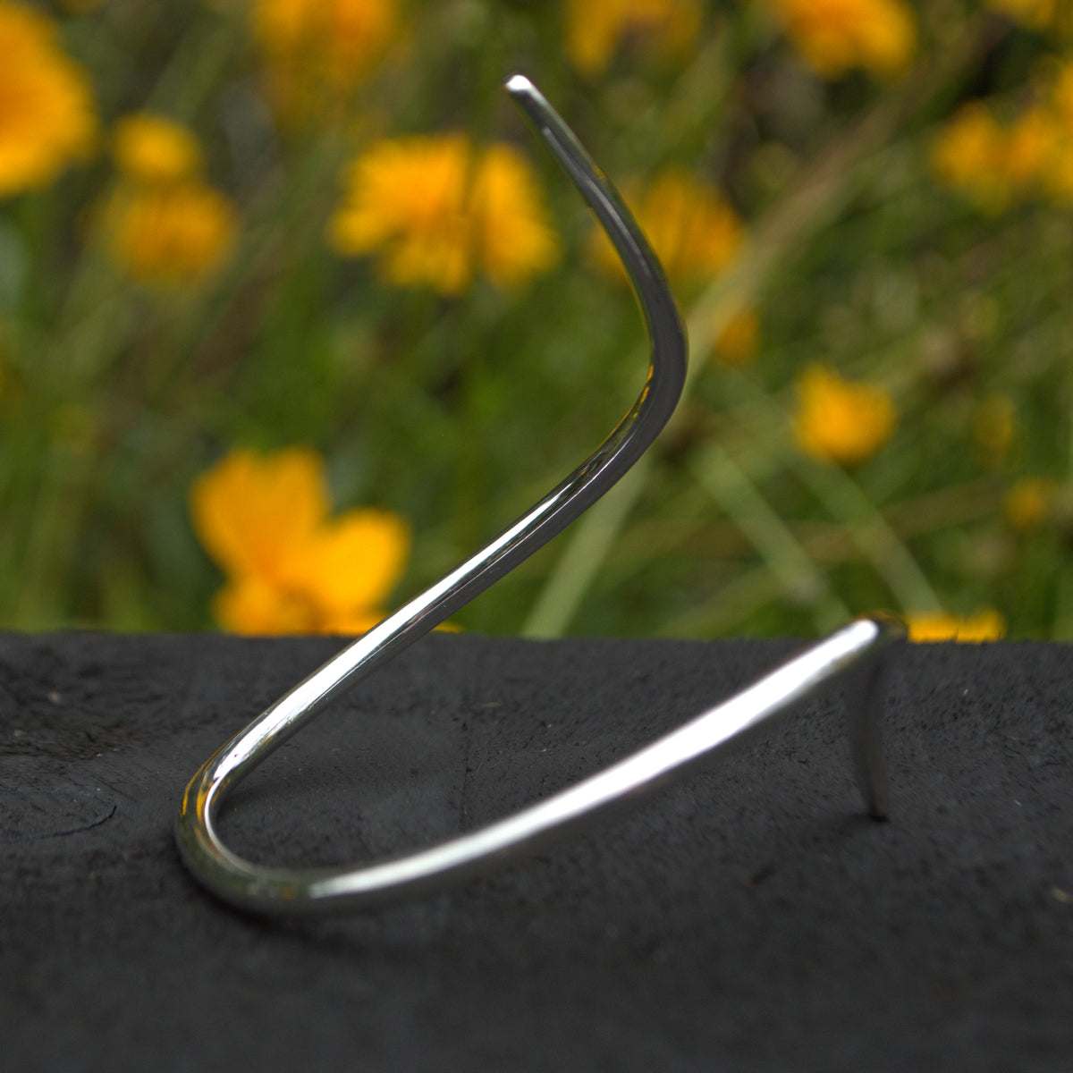 silver hand forged curved bangle – Iceni Silvercraft